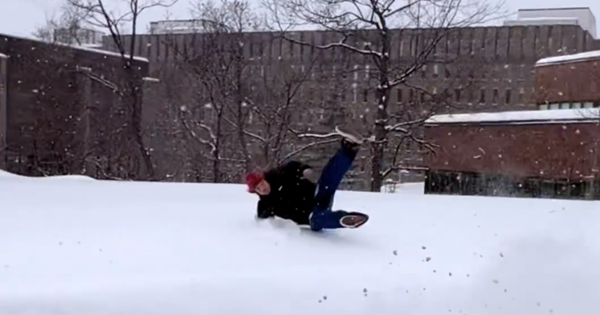Bombing A Snowy Hill Right Into A Snowbank - Skateboarding